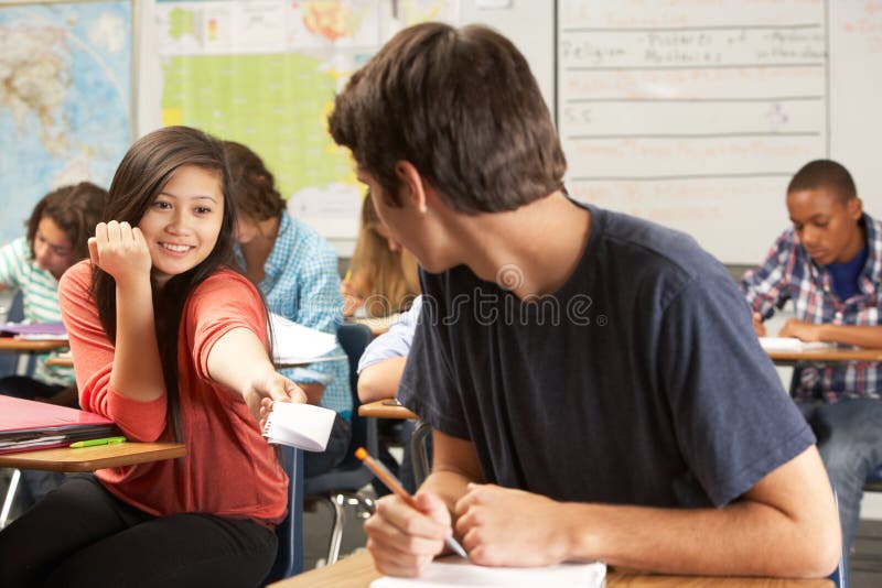 Students Passing Notes in Class Stock Image - Image of notes, female ...