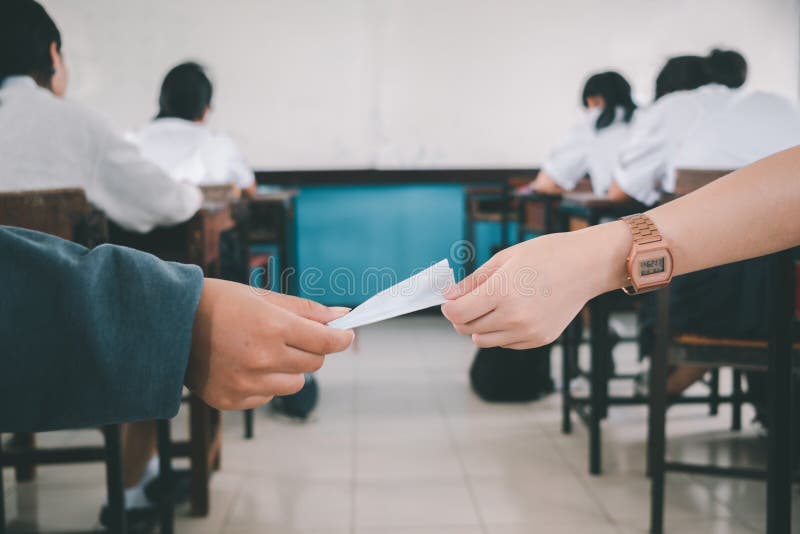 Students Passing Notes in Class Stock Image - Image of horizontal ...
