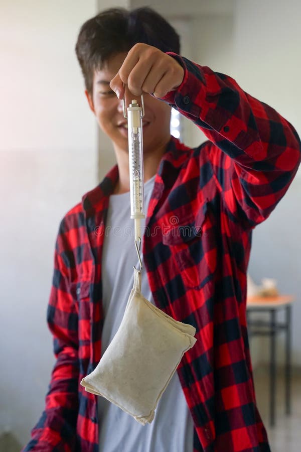 Students Performing Physics Experiment Weight Objects Using Spring ...