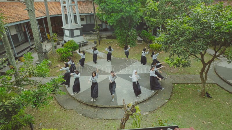 Students Performing Synchronized Dance in School Courtyard Stock Video ...