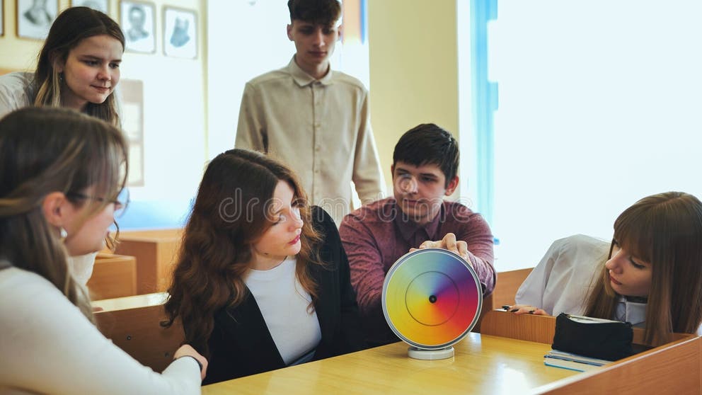 Students in Physics Class Spin Newton S Colorful Wheel. Stock Photo ...