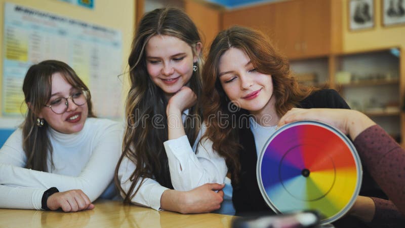 Students in Physics Class Spin Newton S Multicolored Disk. Stock Photo ...
