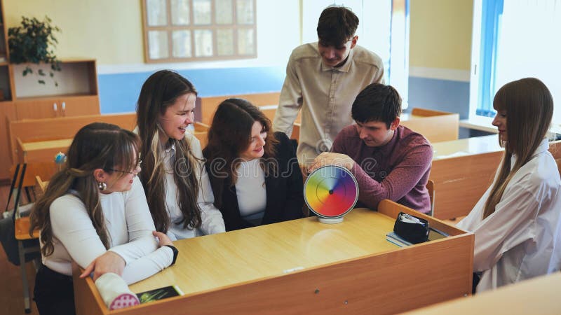 Students in Physics Class Spin Newton S Multicolored Disk. Stock Photo ...