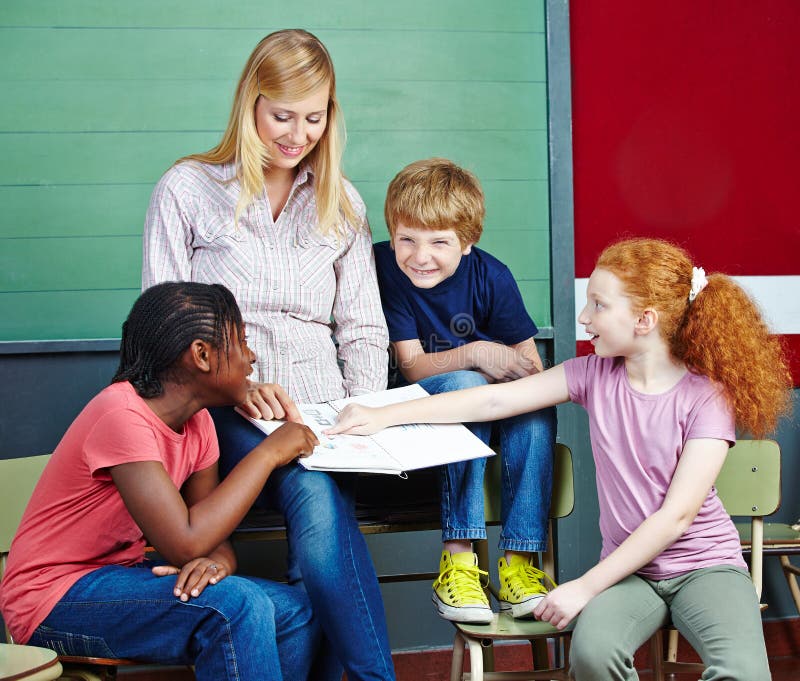 Students Pointing To Notebook Stock Photo - Image of class, book: 41469874