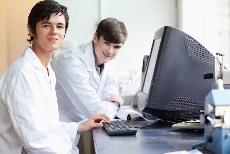 Students Posing with a Monitor Stock Image - Image of caucasian ...