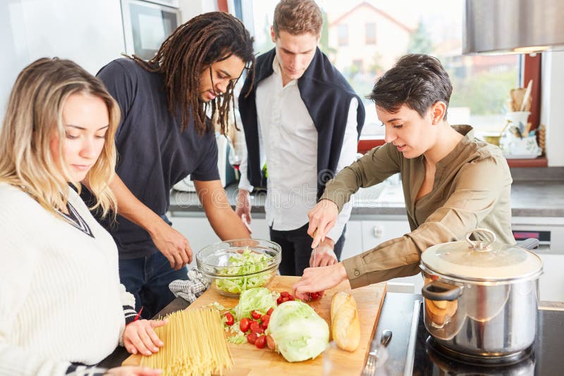 Students Prepare Salad and Lunch Together in the Shared Kitchen Stock ...