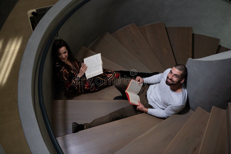 Happy Students Reading Books on Spiral Stairs Stock Image - Image of ...