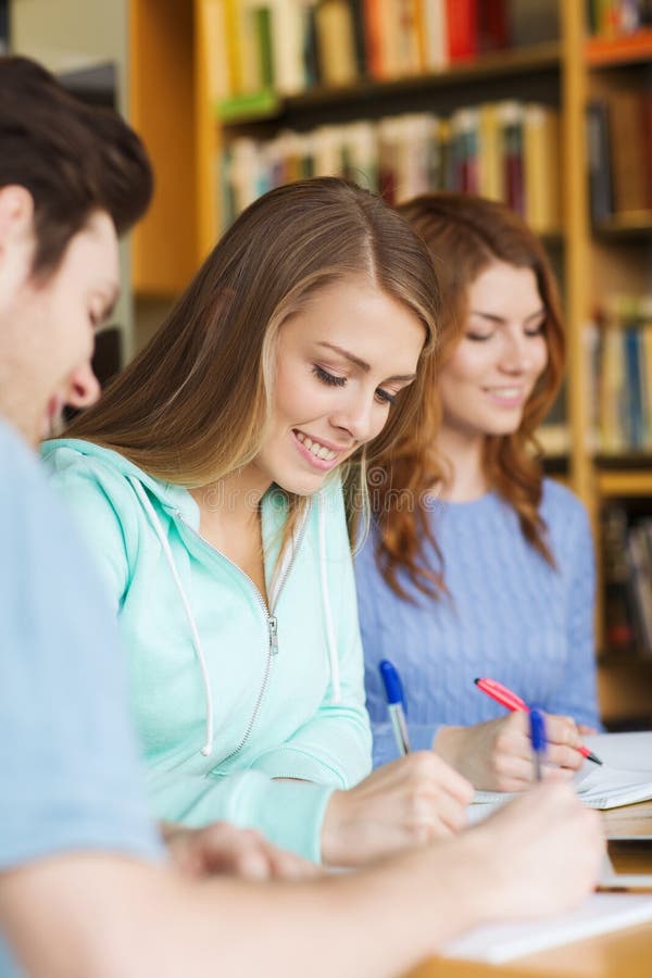 Students Preparing To Exam and Writing in Library Stock Photo - Image ...