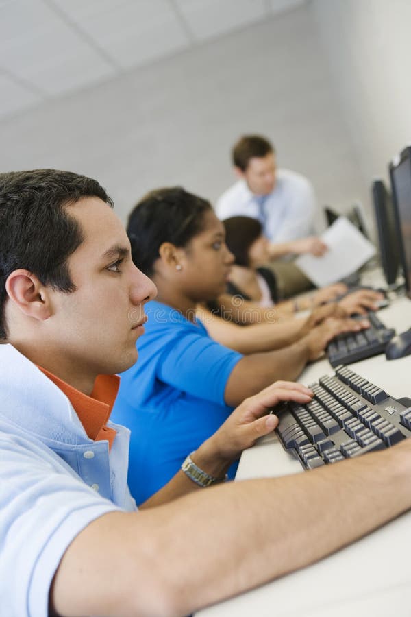 Students with Professor in Computer Lab Stock Photo - Image of hispanic ...