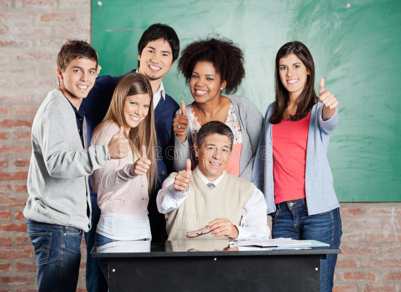 Students and Professor Gesturing Thumbsup at Desk Stock Photo - Image ...