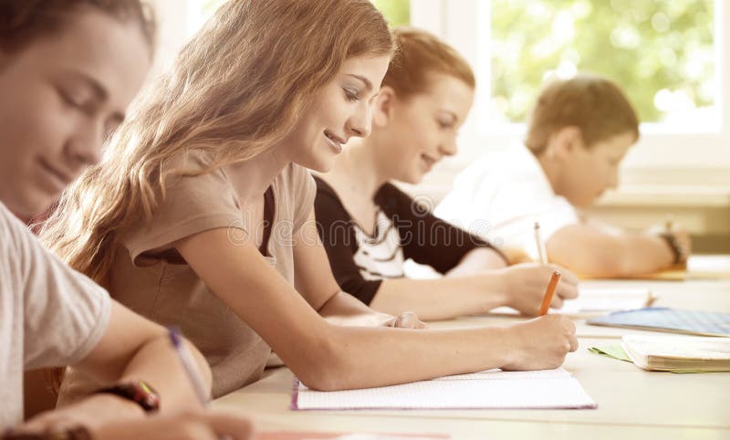 Students Writing a Test in School Concentrating Stock Photo - Image of ...