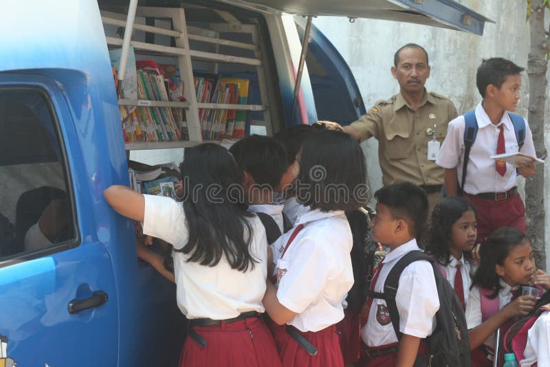 Students Queuing Up To Read a Book in the Mobile Library Editorial ...