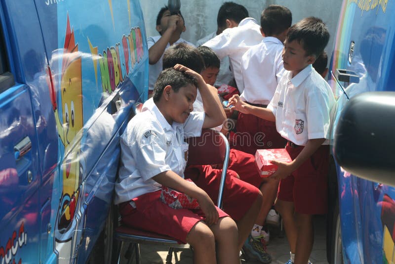 Students Queuing Up To Read a Book in the Mobile Library Editorial ...