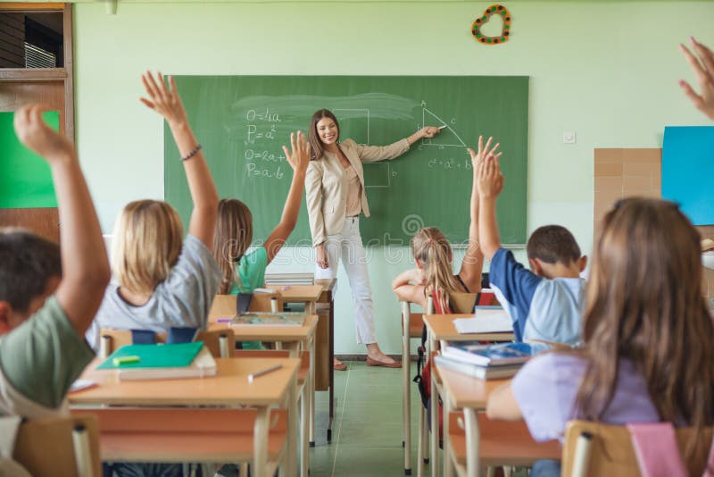 Students Raising Hands in a Maths Lesson Stock Image - Image of school ...