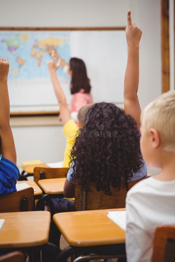 Students Raising Hands To Answer a Question Stock Photo - Image of girl ...