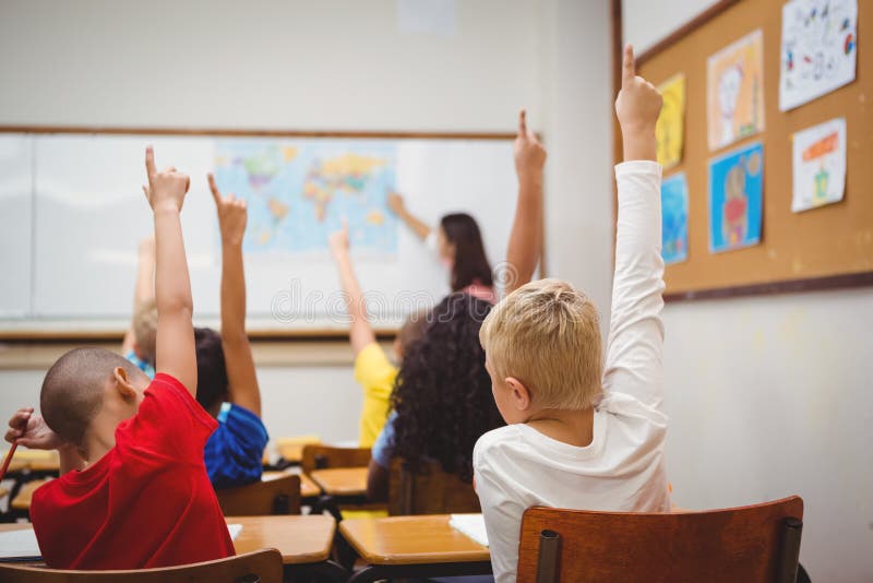Students Raising Hands To Answer a Question Stock Photo - Image of ...