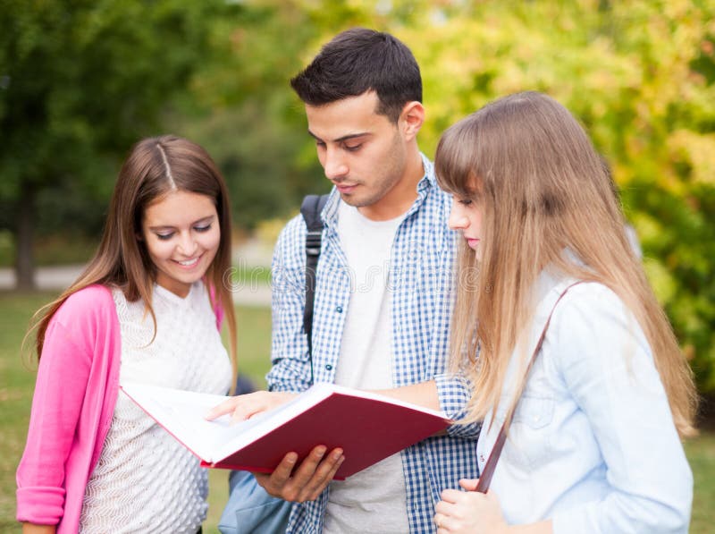 Students reading a book stock image. Image of graduation - 50879861