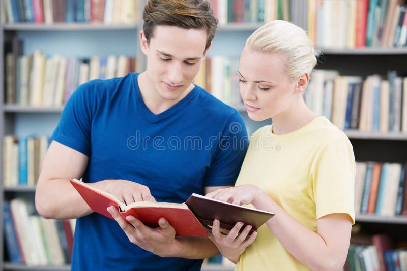 Students Reading Books in Library Stock Photo - Image of occupation ...