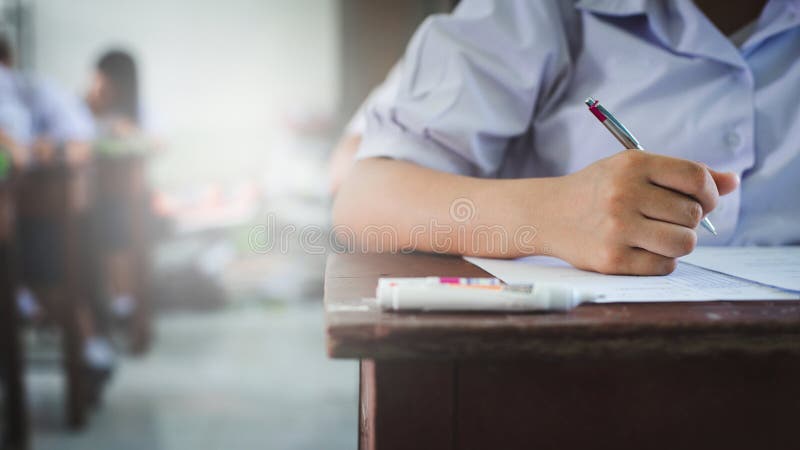 Students Reading Exam Answer Sheets Exercises in Classroom of School ...