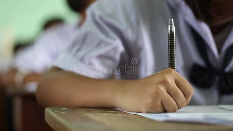 Students Writing and Reading Exam Answer Sheets Exercises in Classroom ...
