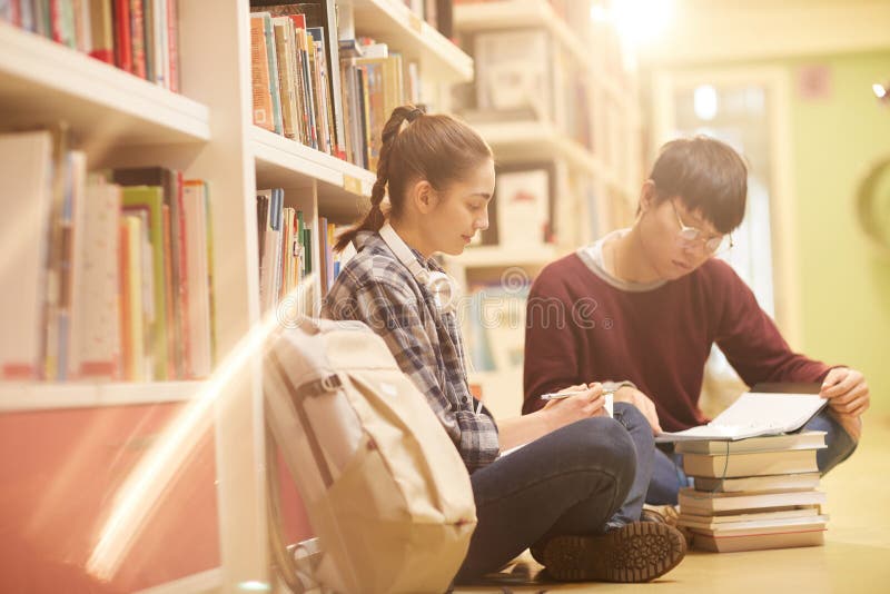 Students Reading in the Library Stock Photo - Image of research ...
