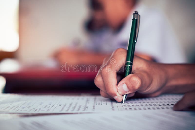 Students Reading and Writing Answer Doing Exam in Classroom with Stress ...