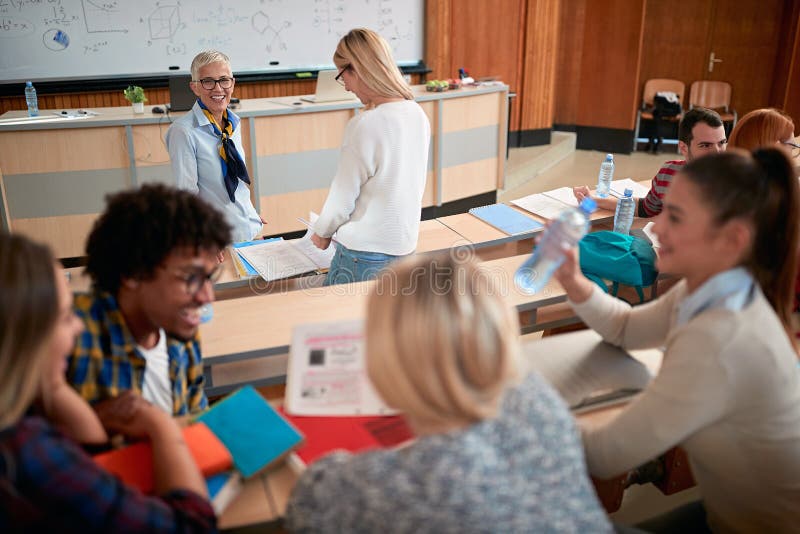 Students in a Relaxed Conversation about a Lecture Stock Photo - Image ...