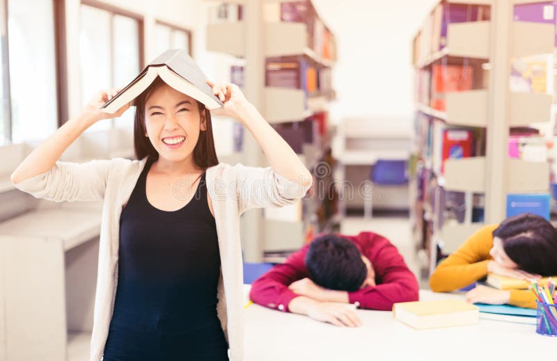 Students rest in library stock image. Image of tired - 105986121