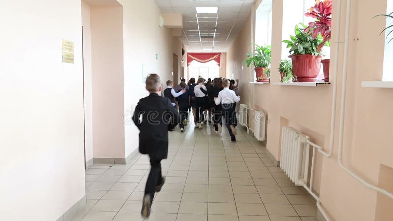 Students Run Down the Corridor in a Crowd during the Break between ...