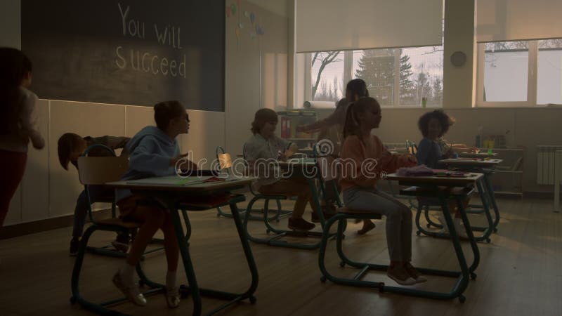 Students Running in Classroom for Lesson. Multi Ethnic Pupils Talking ...