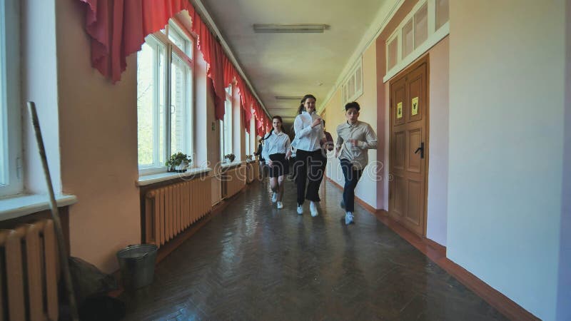The Students are Running Down the Hallway of the School. Stock Image ...