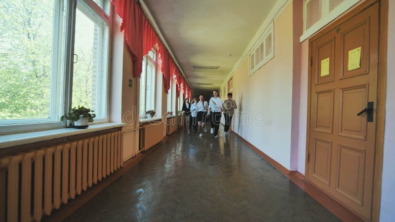 The Students are Running Down the Hallway of the School. Stock Image ...