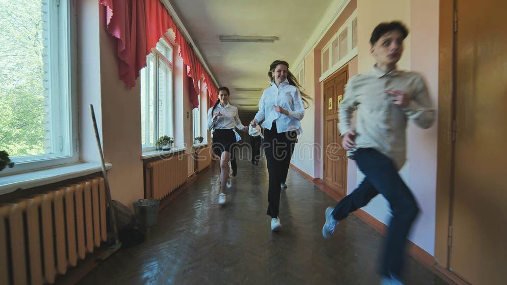 The Students are Running Down the Hallway of the School. Stock Image ...