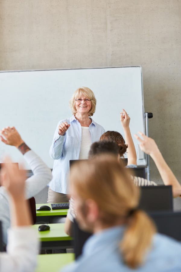 Students in School Know the Answer Stock Photo - Image of lecturer ...