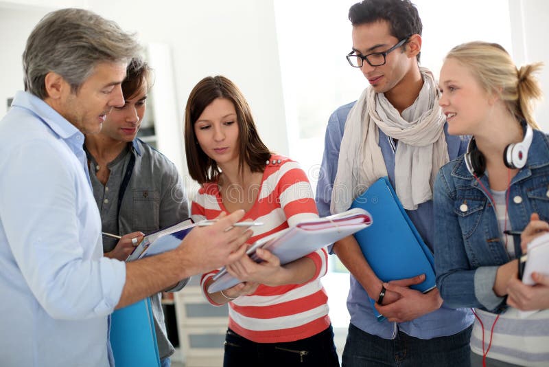 Students at School Talking To Professor Stock Image - Image of asking ...