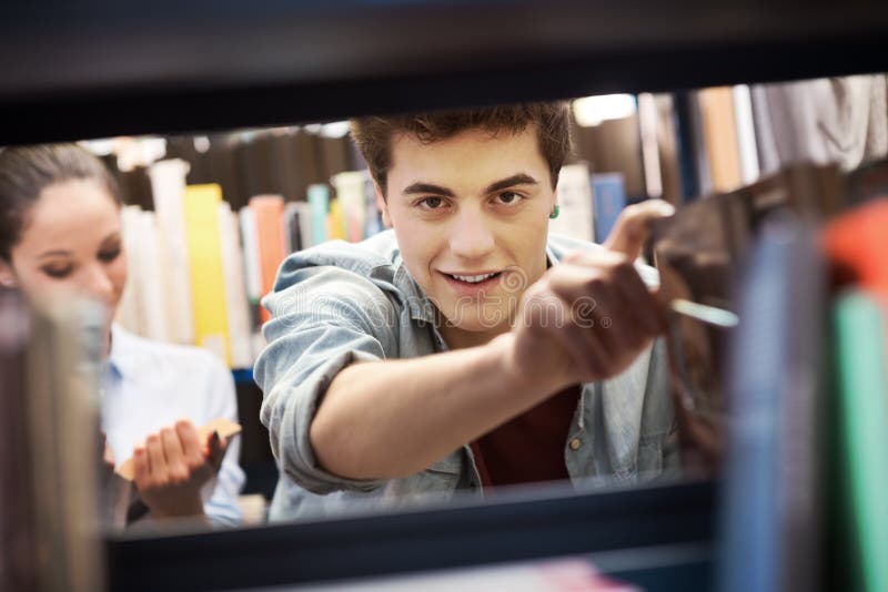 Students Searching for Books at the Library Stock Image - Image of girl ...