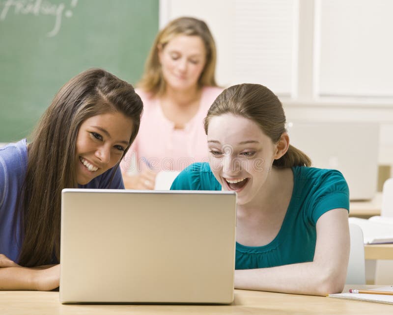 Students Sharing Laptop in Classroom Stock Image - Image of student ...
