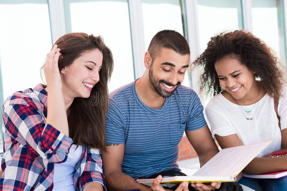 Students sharing notes stock photo. Image of group, college - 56739842