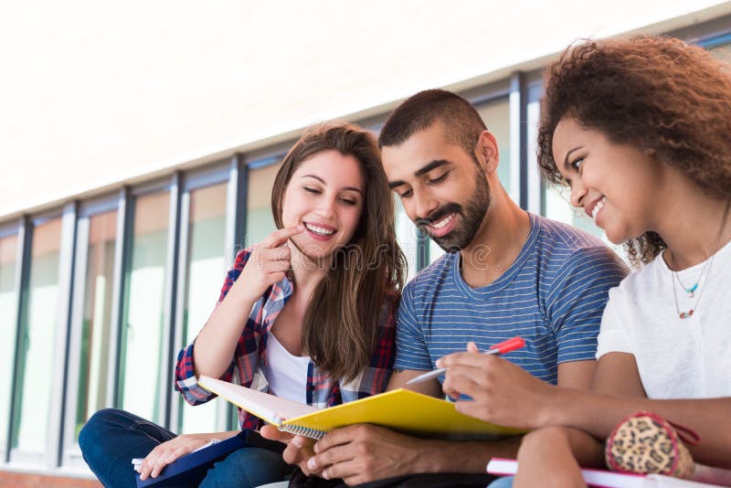 Students sharing notes stock image. Image of grade, people - 56739049