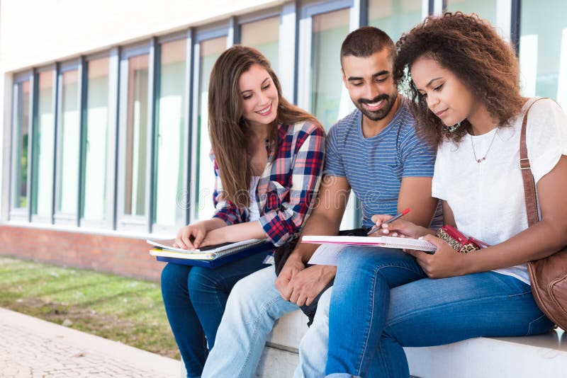 Students sharing notes stock photo. Image of group, college - 56739842