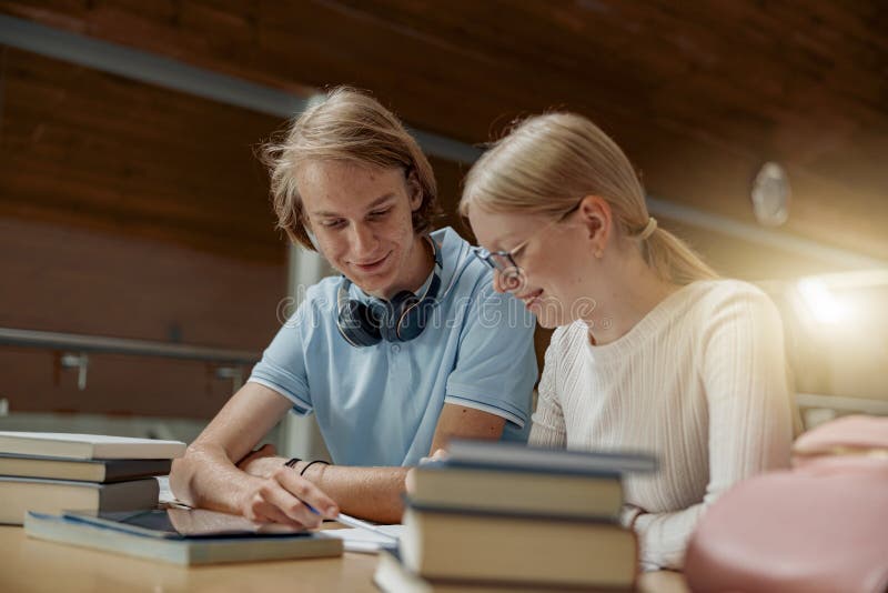 Students Sit in the Library and Take Notes while Preparing for the Exam ...