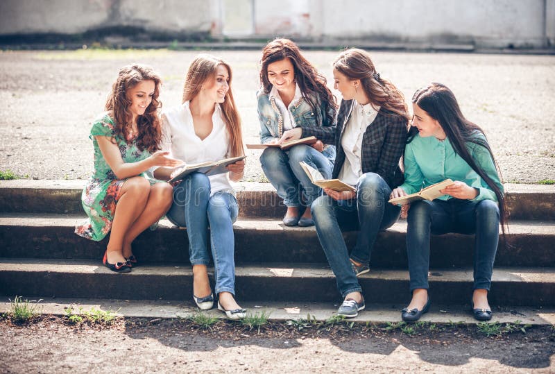Students Sitting with a Books on Street Stock Image - Image of friends ...