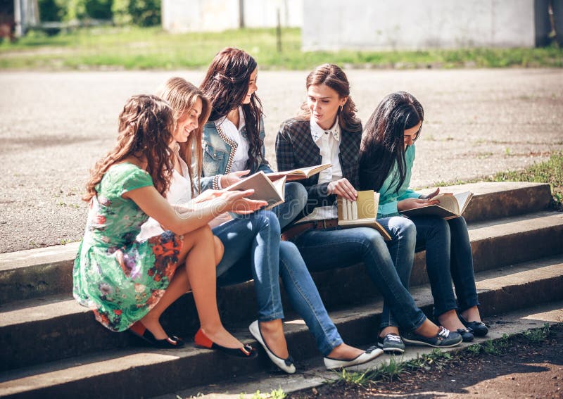 Students Sitting with a Books on Street Stock Photo - Image of diverse ...
