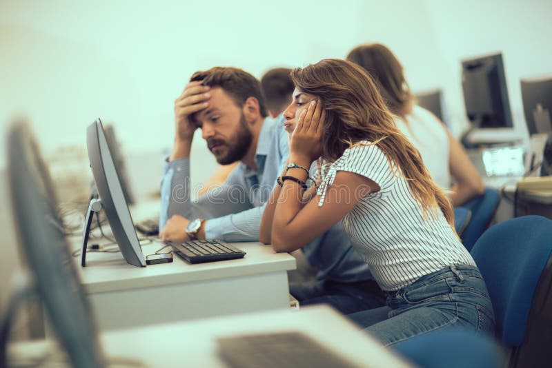 Students Sitting in a Classroom, Using Computers during Class Stock ...