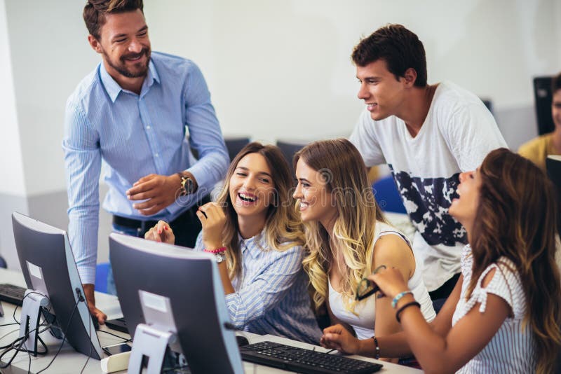 Students Sitting in a Classroom, Using Computers during Class Stock ...