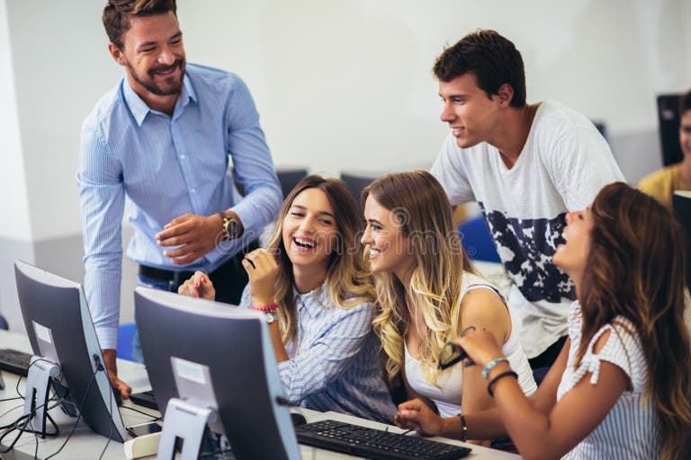 Students Sitting in a Classroom, Using Computers during Class Stock ...