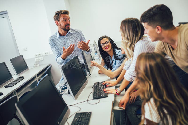 Students Sitting in a Classroom, Using Computers during Class Stock ...