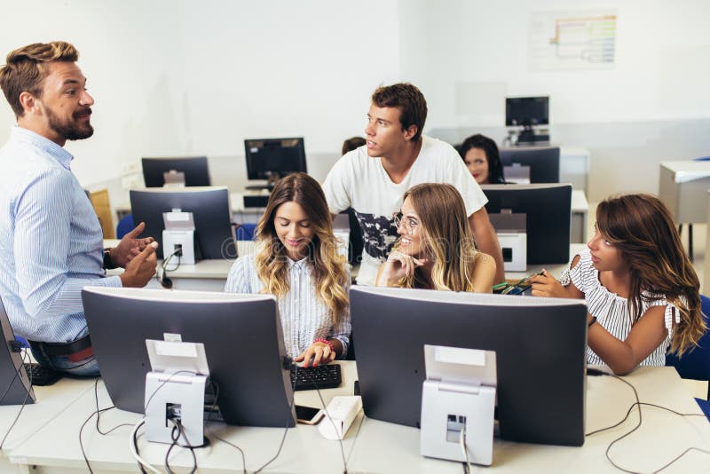 Students Sitting in a Classroom, Using Computers during Class Stock ...