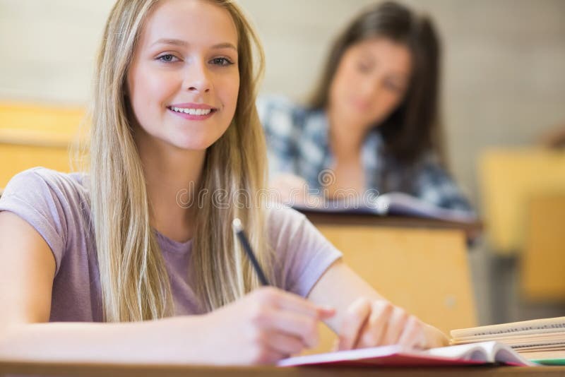 Students Sitting beside Each Other while Learning Stock Photo - Image ...