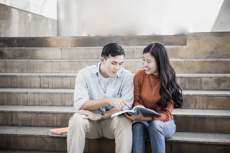 Students Sitting Reading Books Together Stock Photo - Image of ...